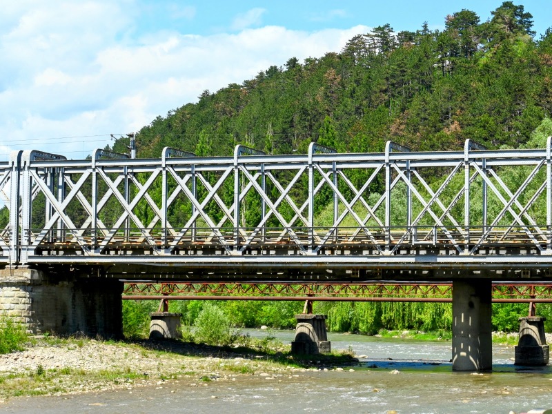 Steel Truss Bridge Over a Mountain River Jigsaw Puzzle